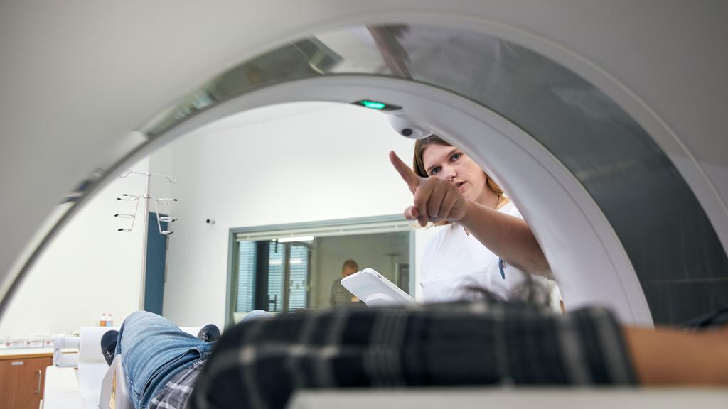 How can intelligent and personalized CT scanning ease radiology workflow?